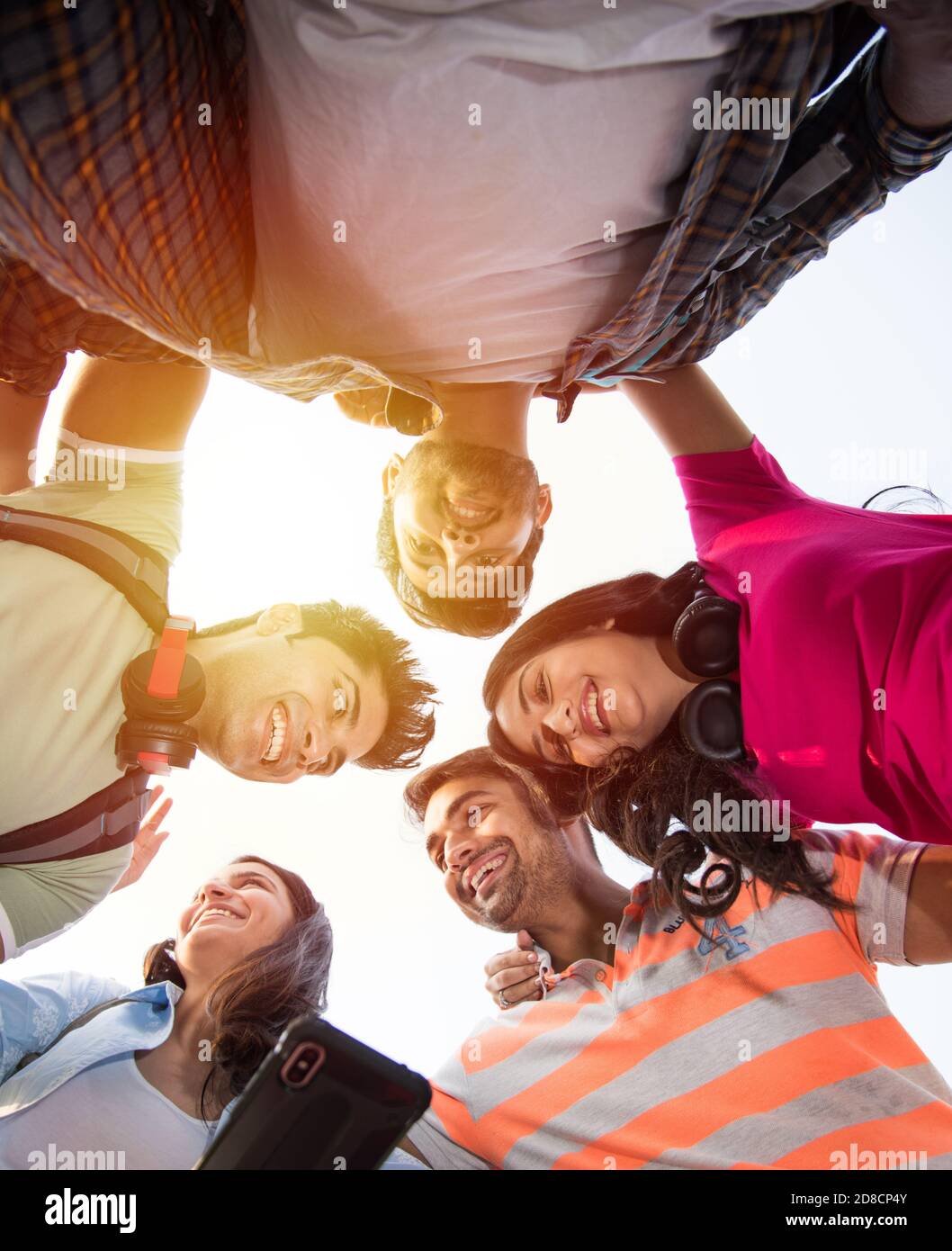 Cheerful Indian asian young group of college students forming a circle ...