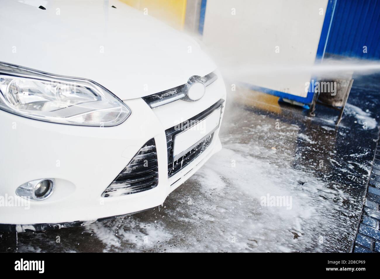Washing white transportation on car wash Stock Photo - Alamy
