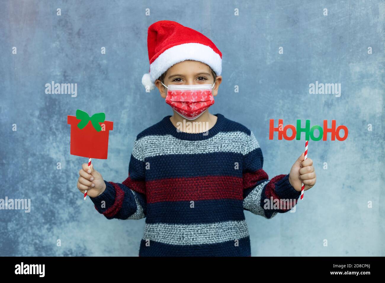 Little kid with face mask on Christmas Stock Photo - Alamy