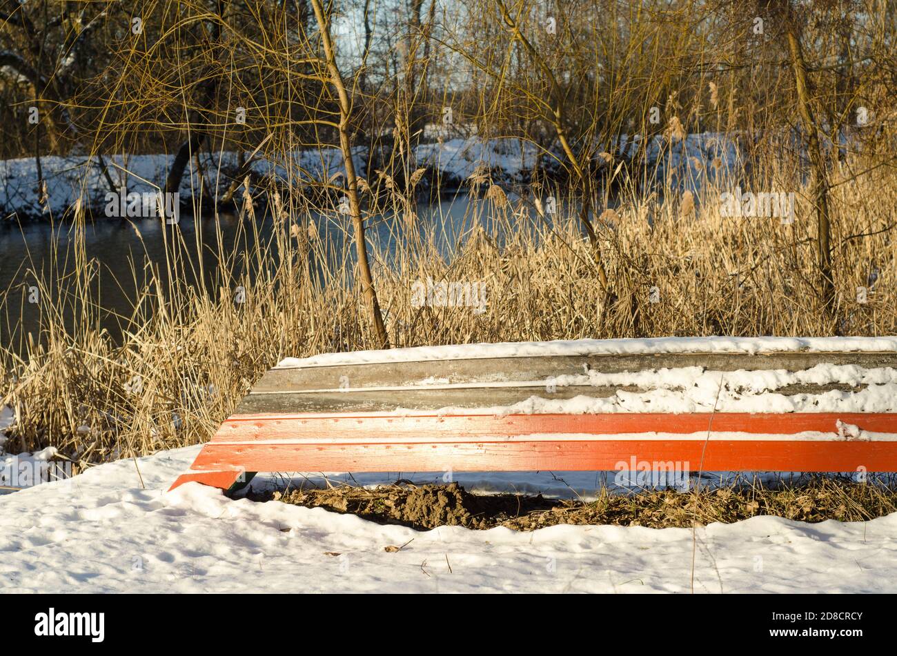 boat on the river bank in snow Stock Photo - Alamy
