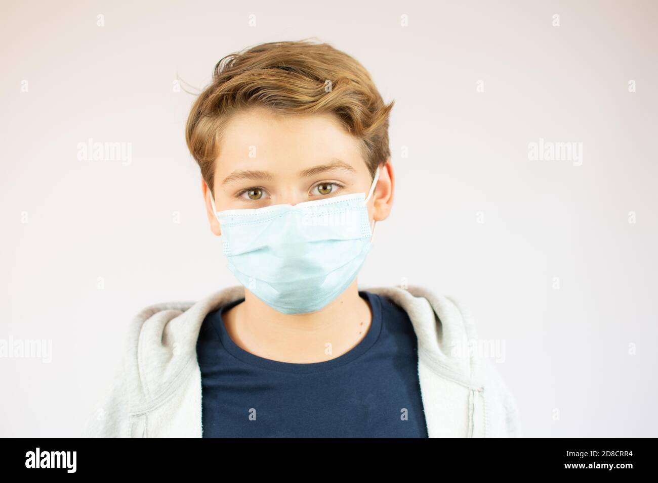 Kid boy wearing face mask on white background Stock Photo - Alamy