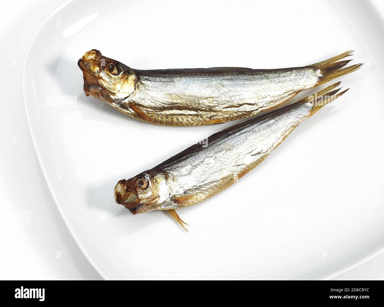 SPRAT sprattus sprattus, SMOKED FISH ON PLATE Stock Photo - Alamy