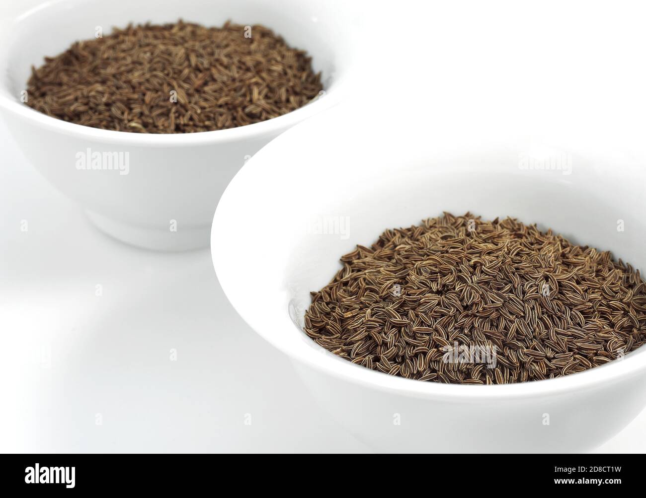 CARAWAY SEEDS carum carvi IN BOWLS Stock Photo - Alamy