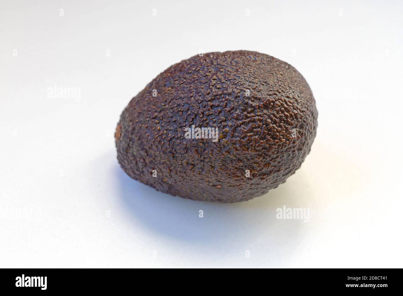 Dark Brown Skin at One Avocado Vegetable Stock Photo - Alamy