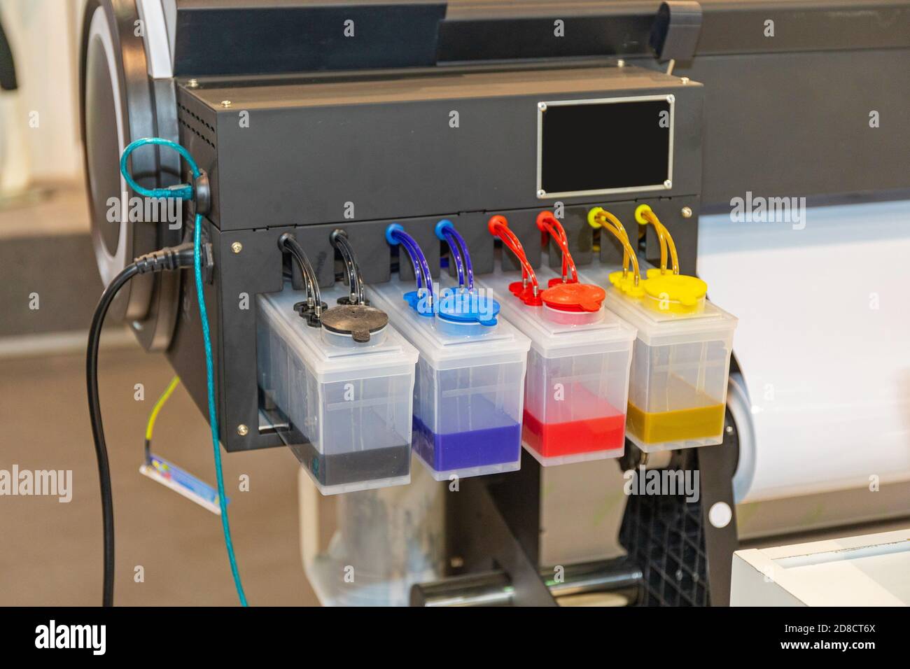Four Colour Ink Tanks at Big Roll Printer Stock Photo - Alamy