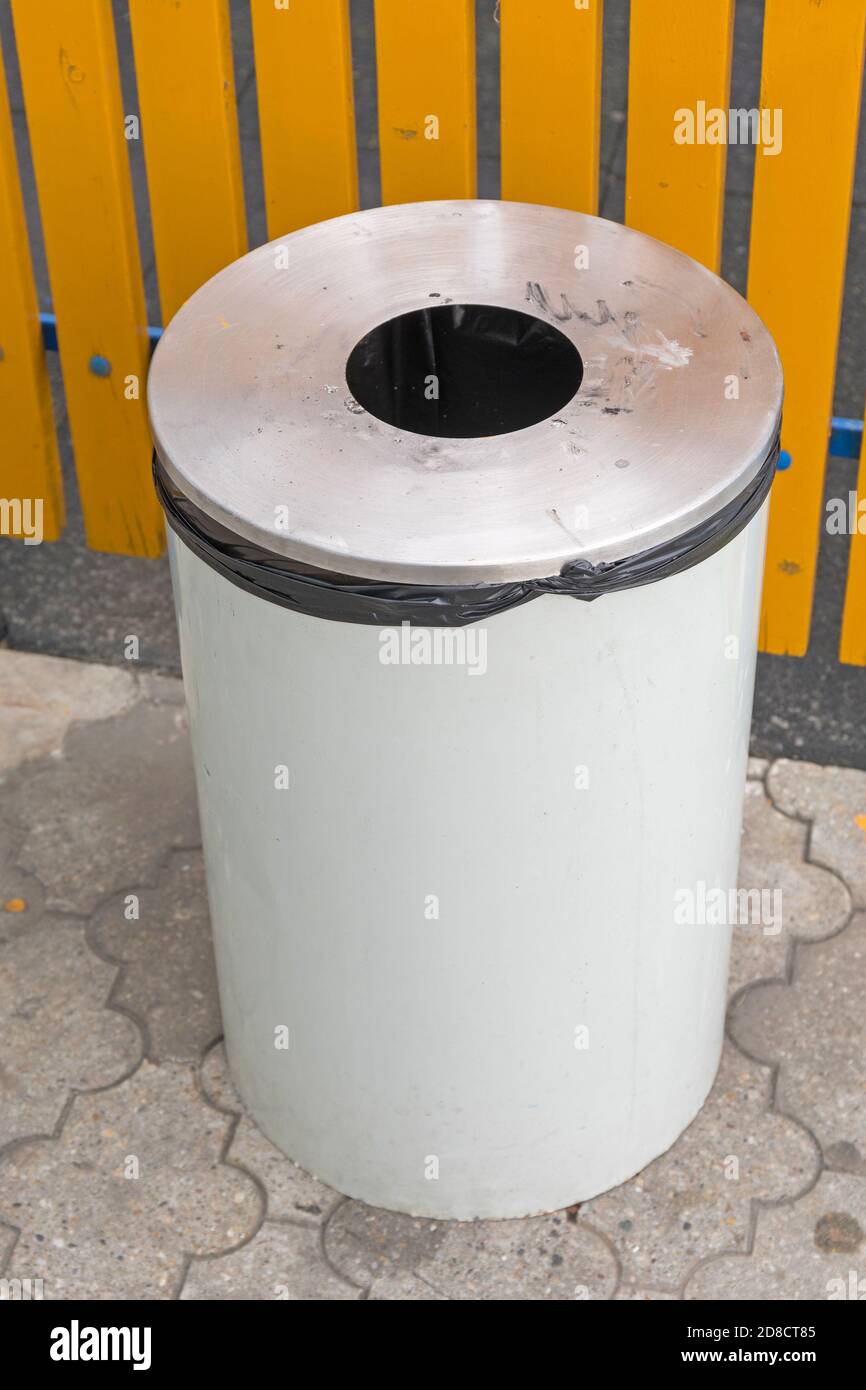 Big White Garbage Bin at Pavement Street Stock Photo - Alamy
