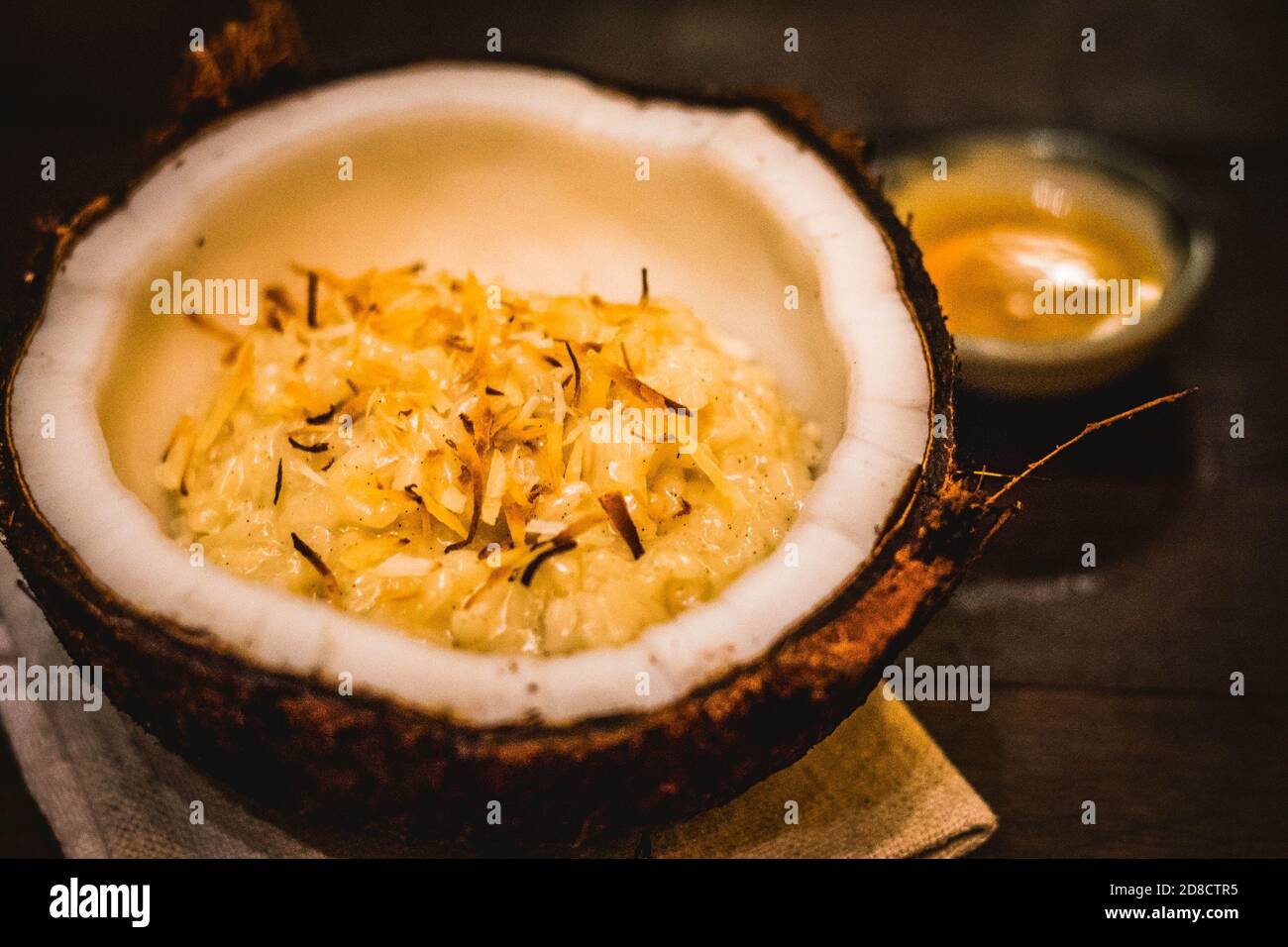 a traditional thai dessert of rice pudding in coconut milk served with ...