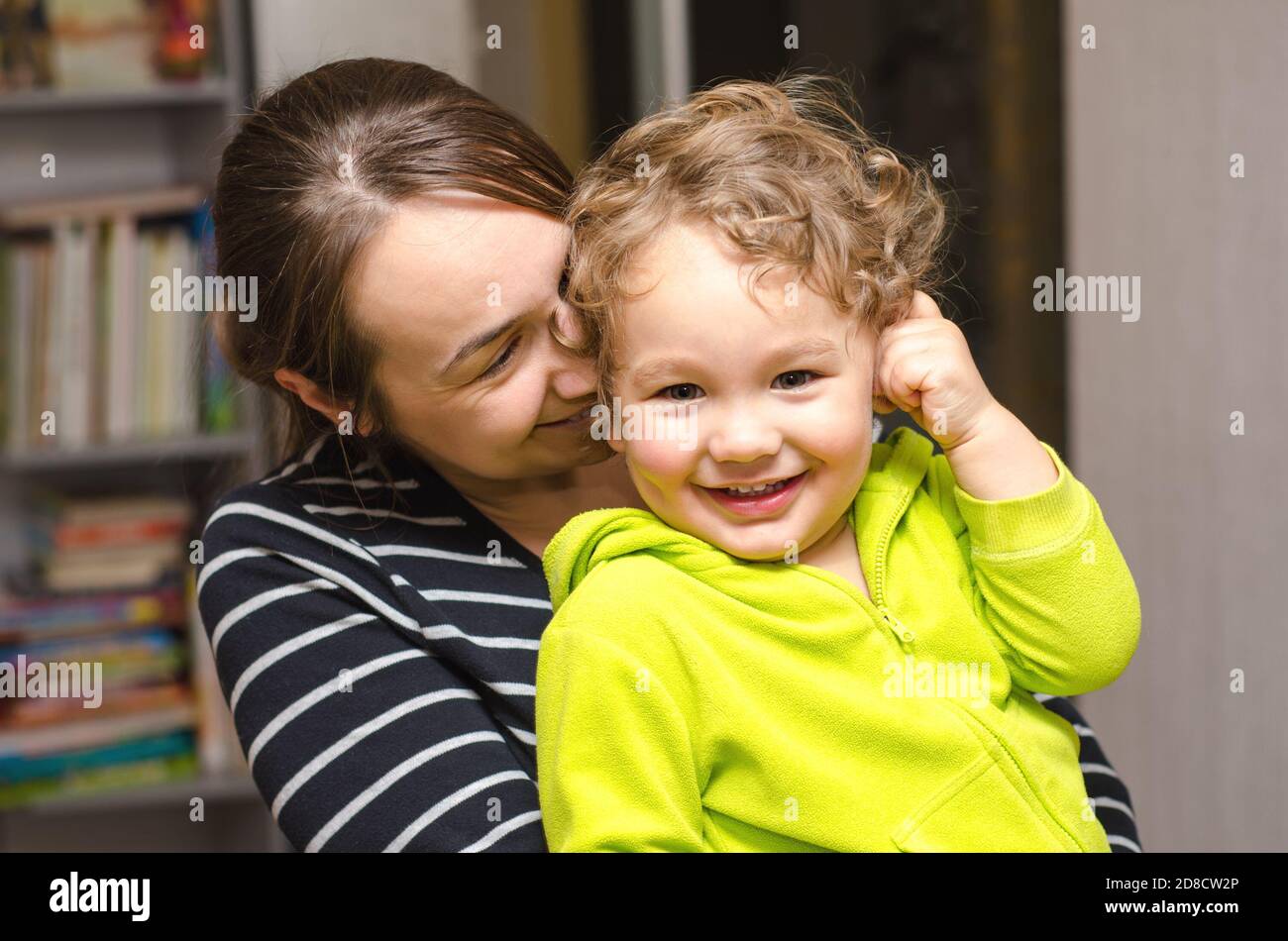 mother embracing child at home Stock Photo - Alamy