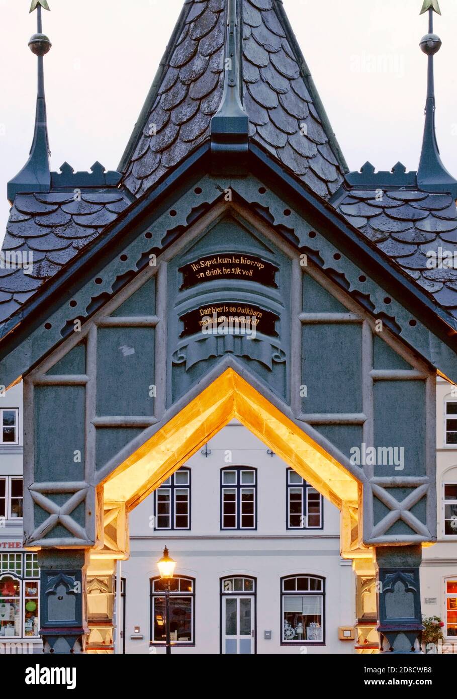 historic water pump on the market square in the evening, Germany ...