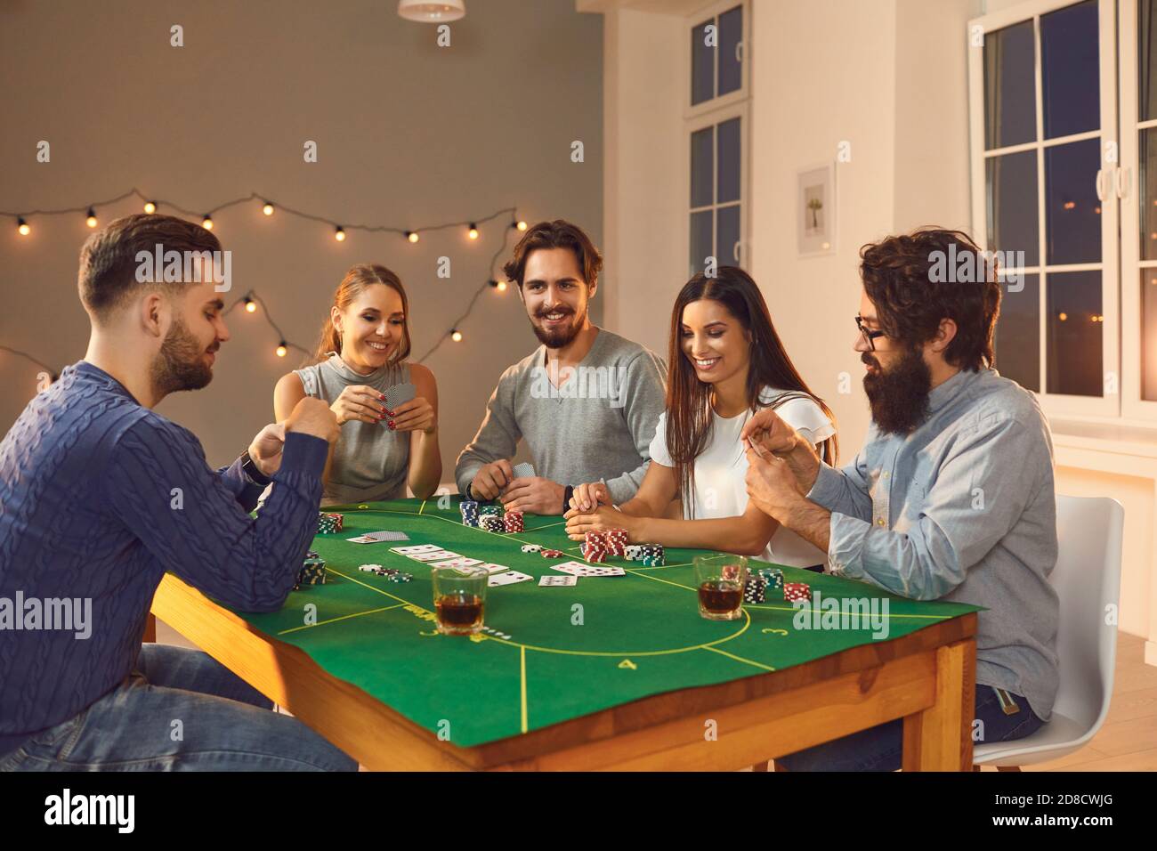 People sitting poker table playing hi-res stock photography and images ...