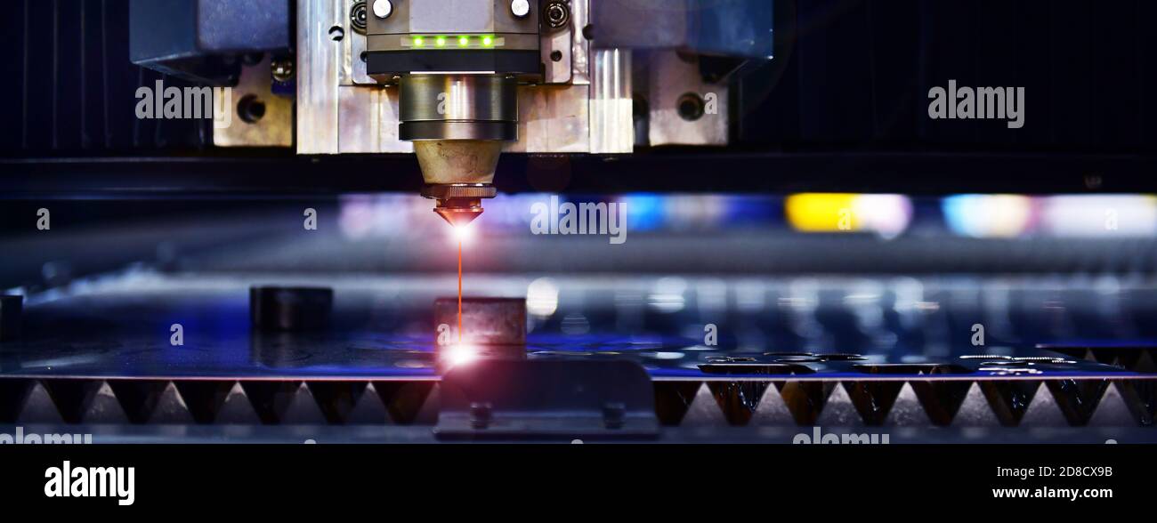 Laser cut head machine while cutting the sheet metal with the sparking ...