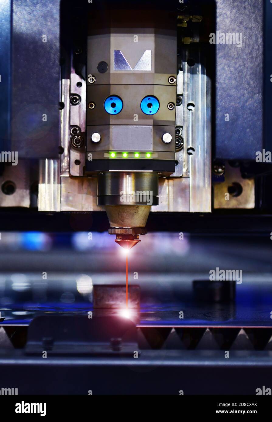 Laser cut head machine while cutting the sheet metal with the sparking ...