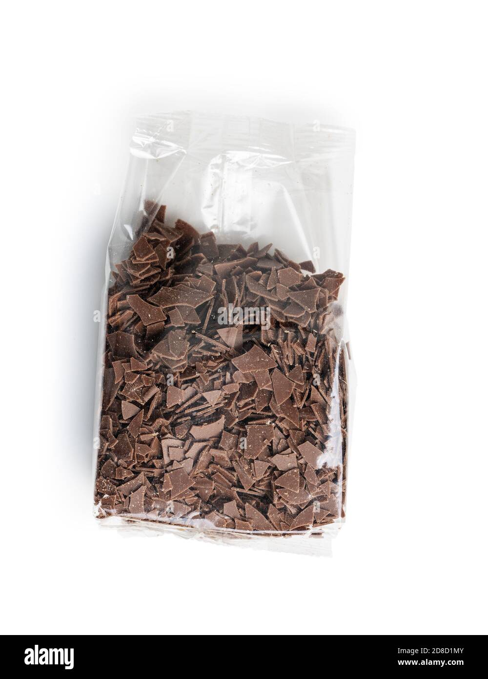 Grated dark chocolate in plastic bag. Chocolate flakes isolated a on ...