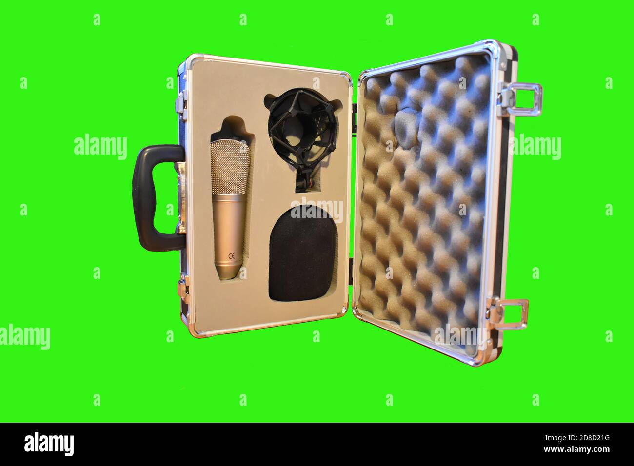 Isolated top view of a box of a condenser microphone set on a green ...