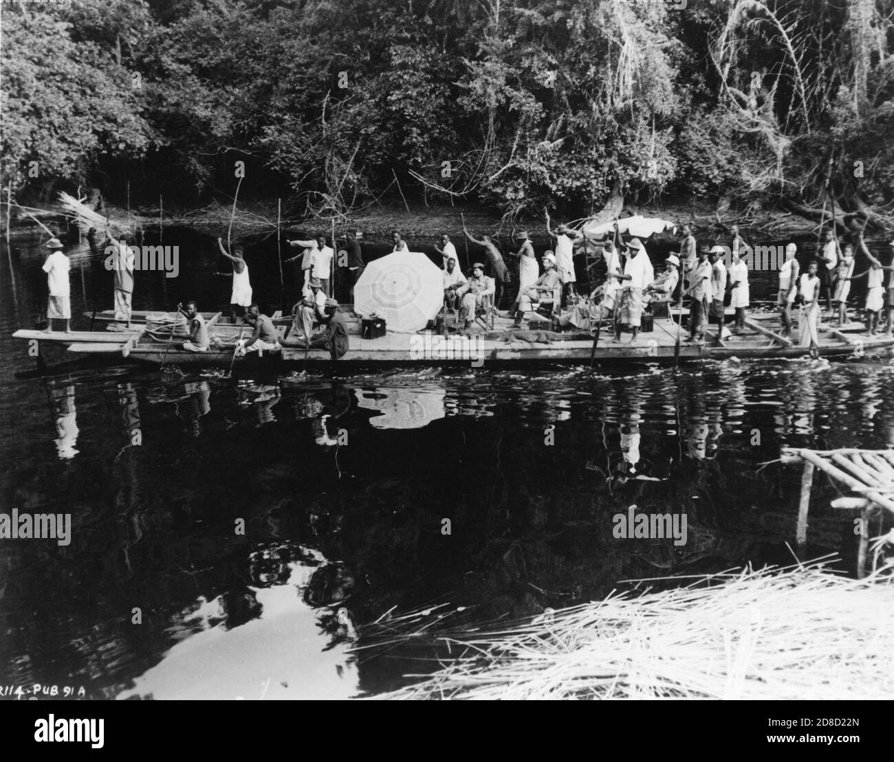Film Crew floating down river in Africa during location filming of THE ...