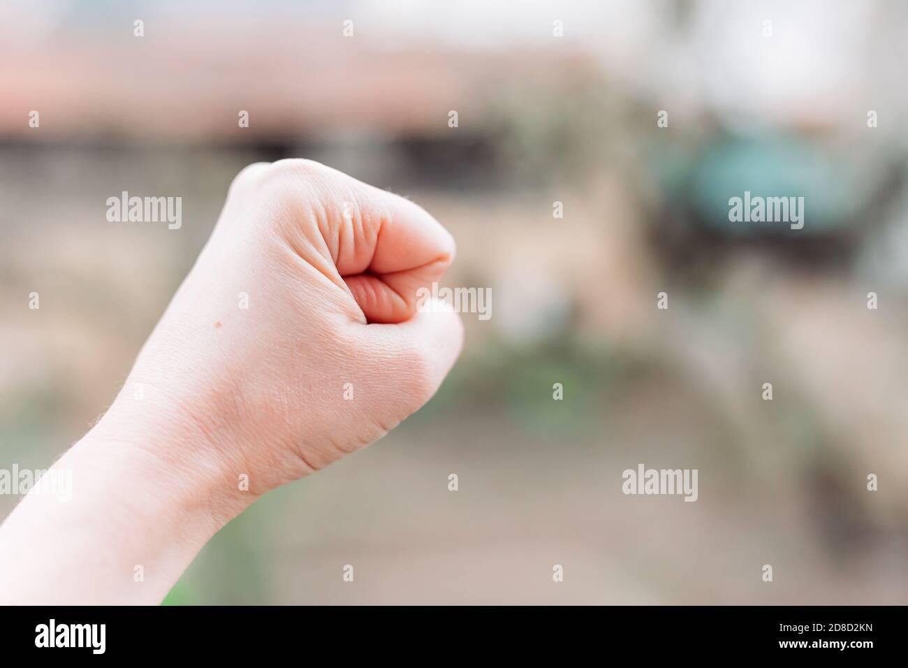 Close-up photo of female fist. Fight for women rights. Space for text ...