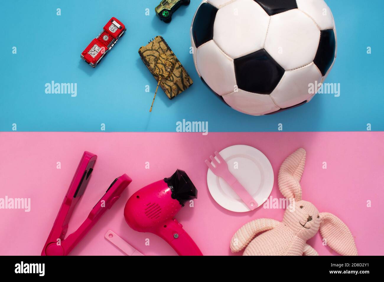 Gender stereotype toys on pink and blue background Stock Photo - Alamy