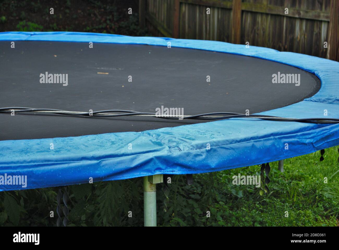Dangerous live downed power line draped across trampoline Stock Photo ...