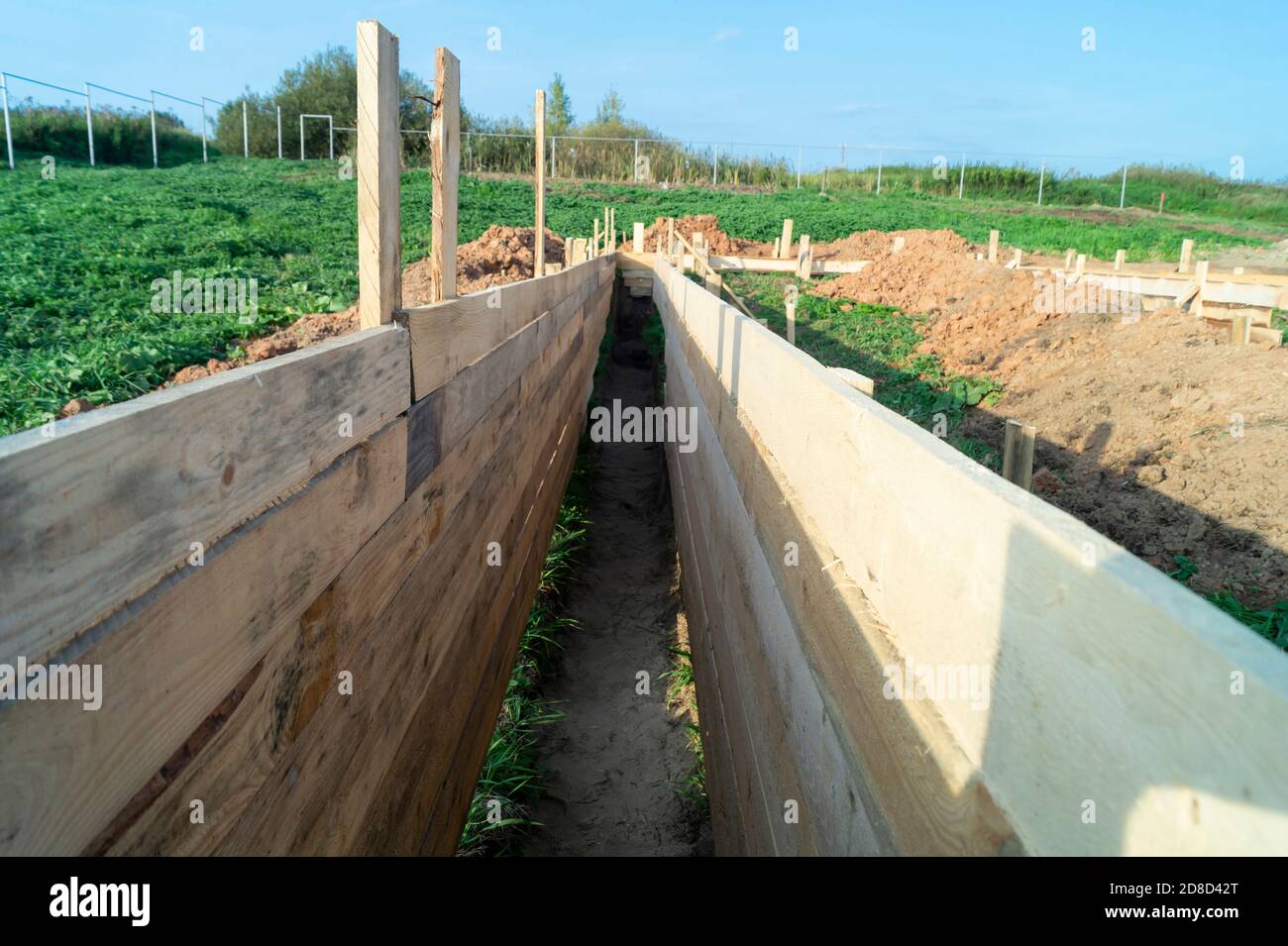 The Wooden framework for foundation in the land on background sky ...