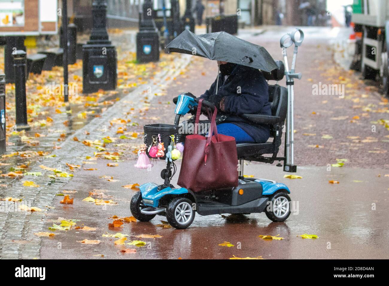 Powered wheelchair user in Preston, Lancashire. Uk Weather. October ...