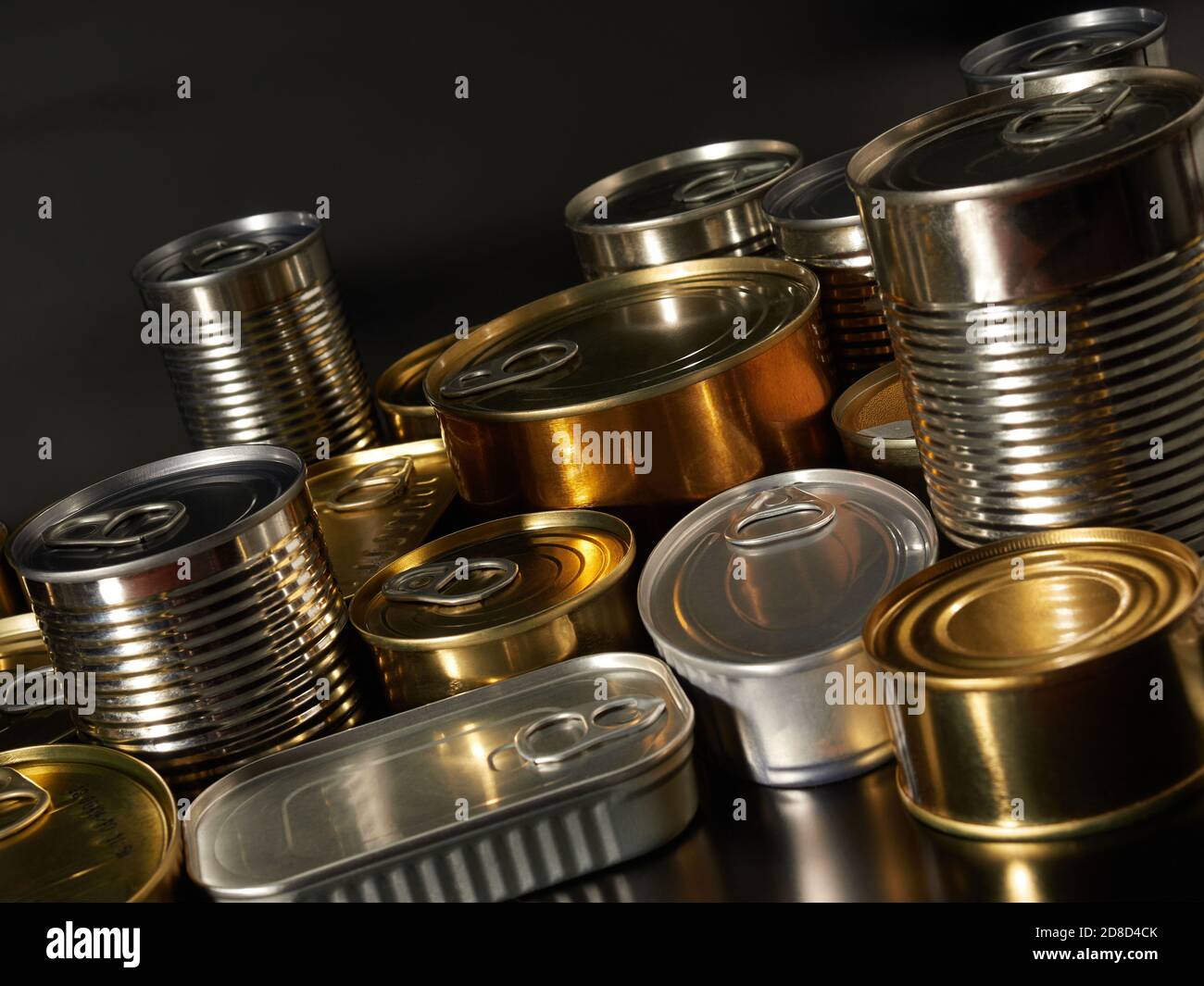 Different types of cans with prepared foods for consumption, vegetables ...