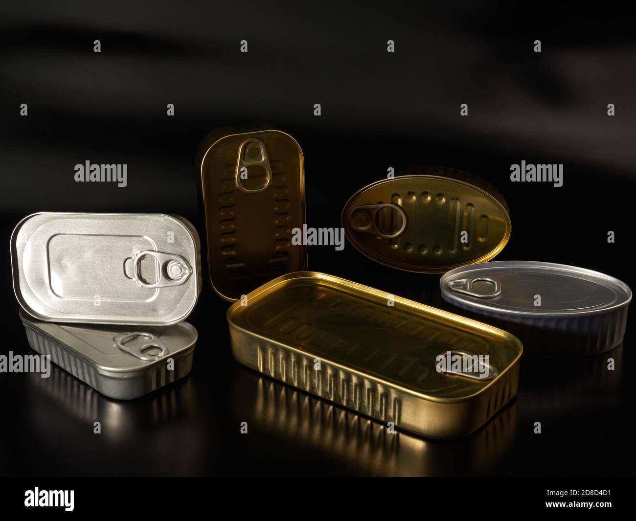 Different types of cans with prepared foods for consumption, vegetables ...