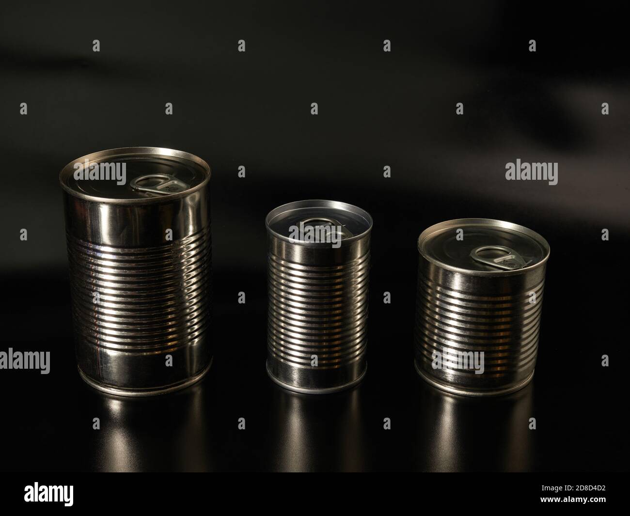 Different types of cans with prepared foods for consumption, vegetables ...