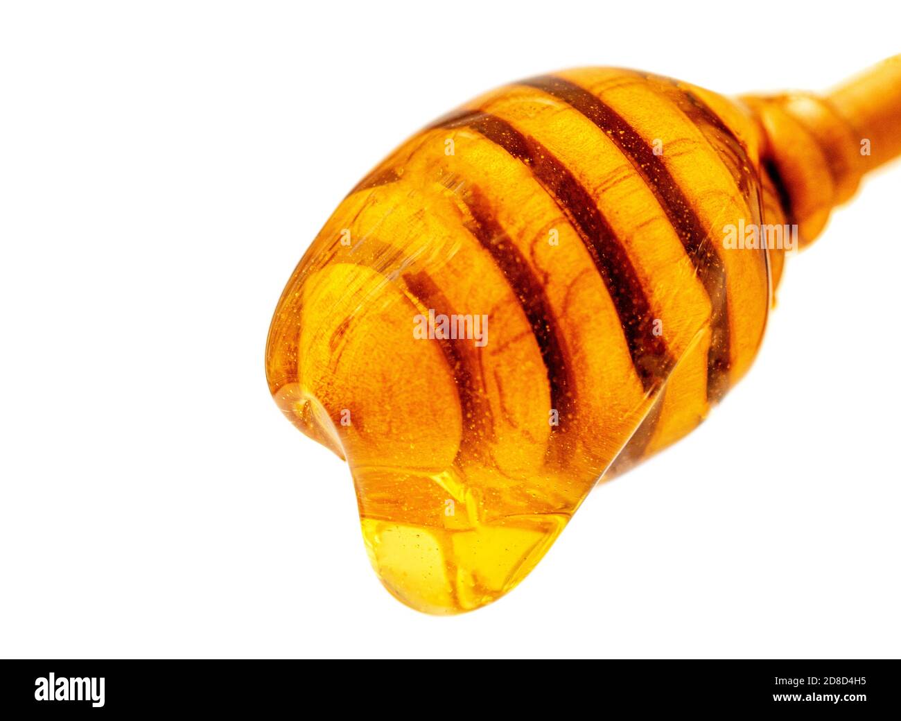 Honey dipper and sweet honey isolated on white background Stock Photo ...