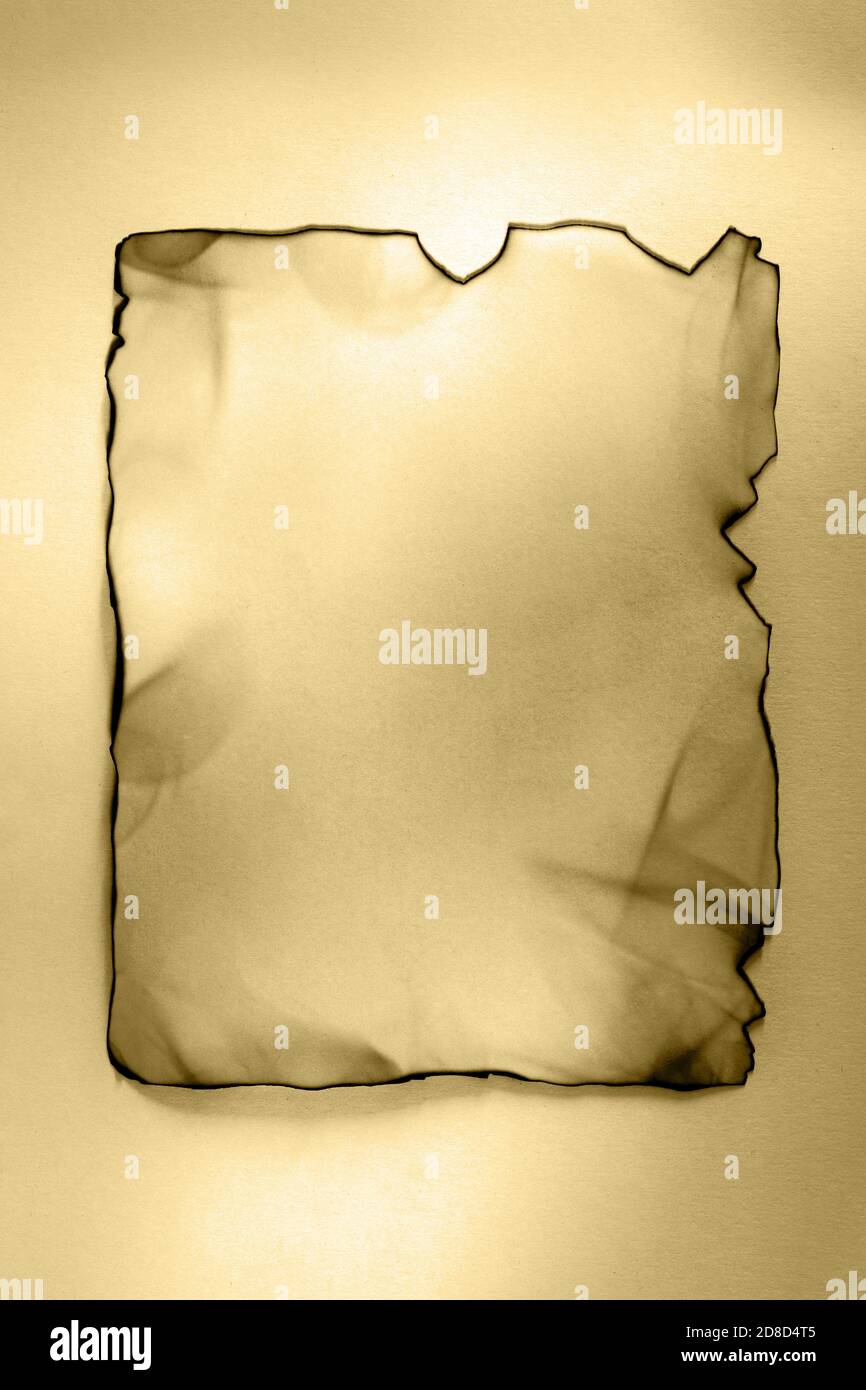 Aged white paper burned with fire on the edges against the white ...