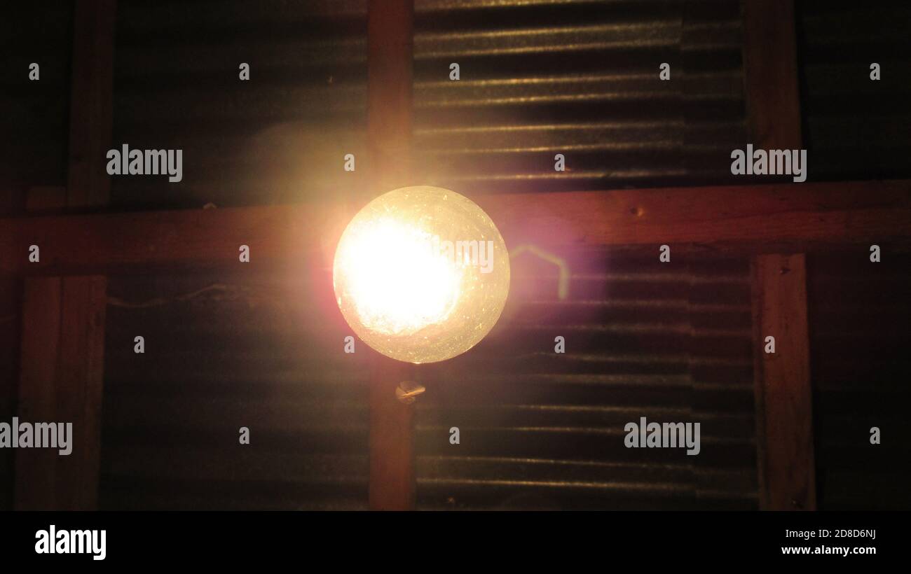 Close up of a lamp lighting in the dark Stock Photo - Alamy