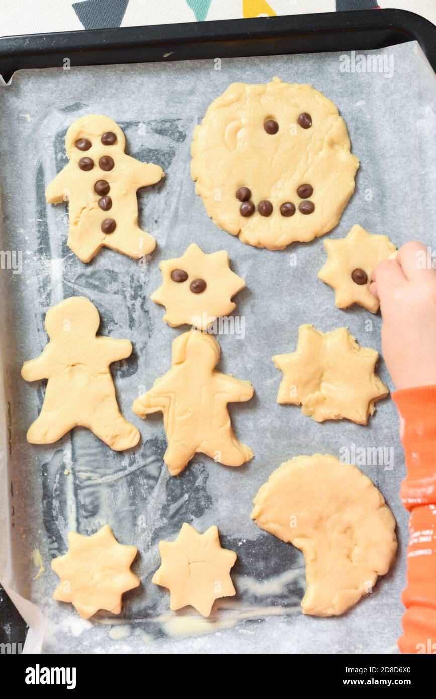 Kids are baking cookies in the kitchen the children are having fun ...