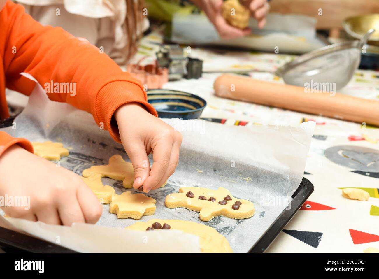 Kids are baking cookies in the kitchen the children are having fun ...