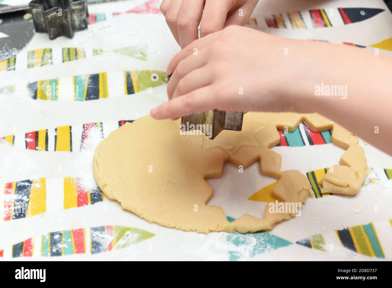 Kids are baking cookies in the kitchen the children are having fun ...