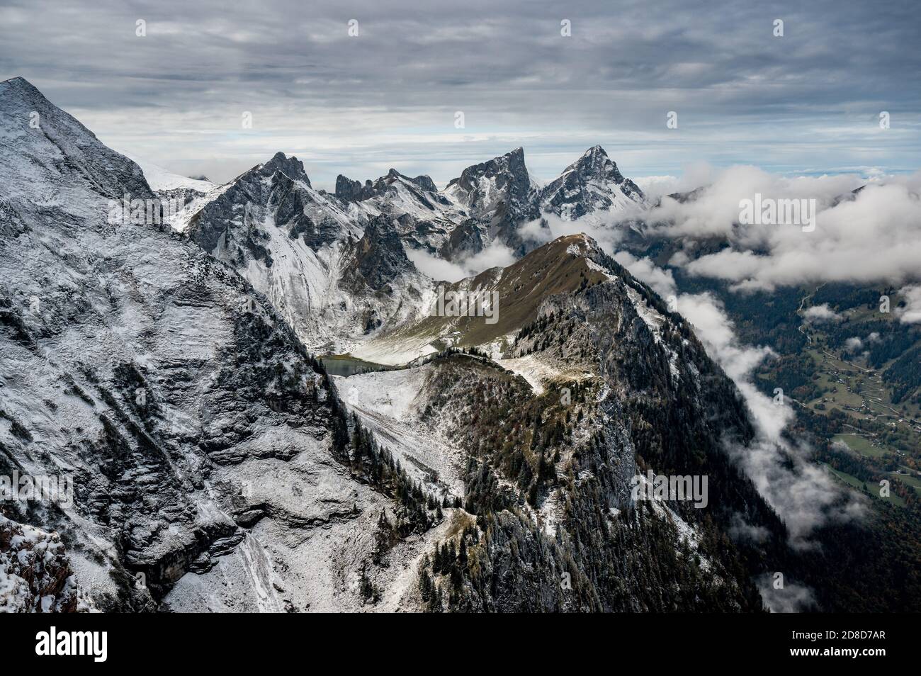 Lac de Lovenex and the peaks of Grande Miette with the village La ...
