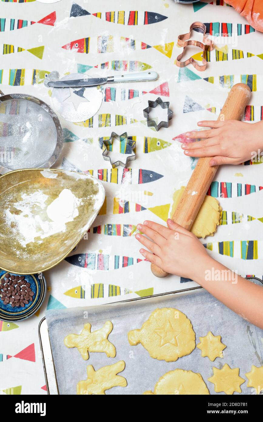 Kids are baking cookies in the kitchen the children are having fun ...