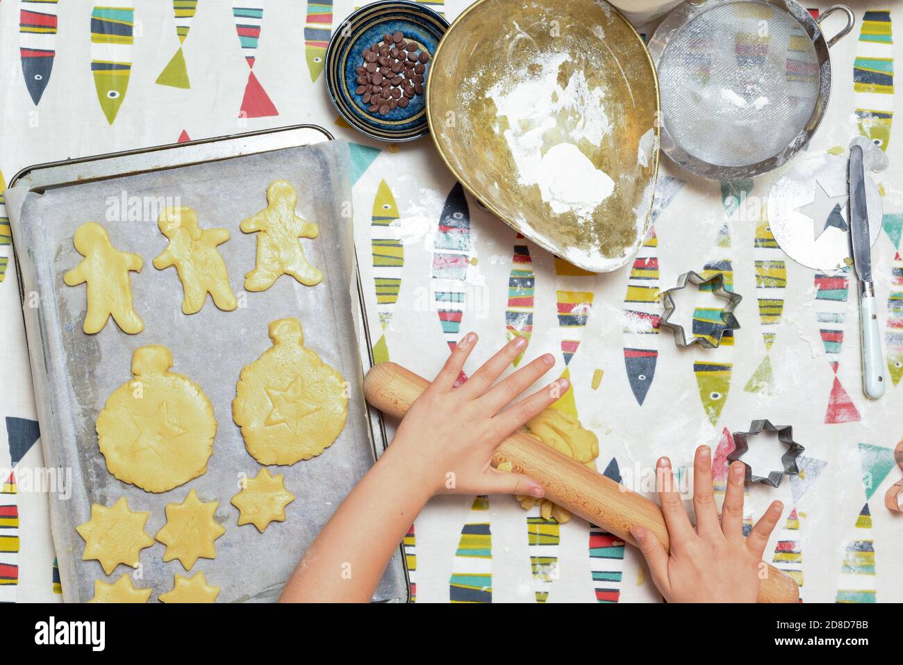 Kids are baking cookies in the kitchen the children are having fun ...