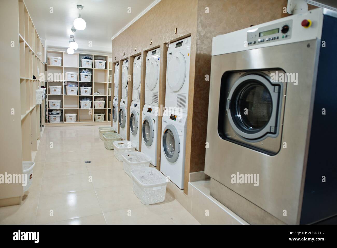 Washing machines in the self service laundry Stock Photo - Alamy
