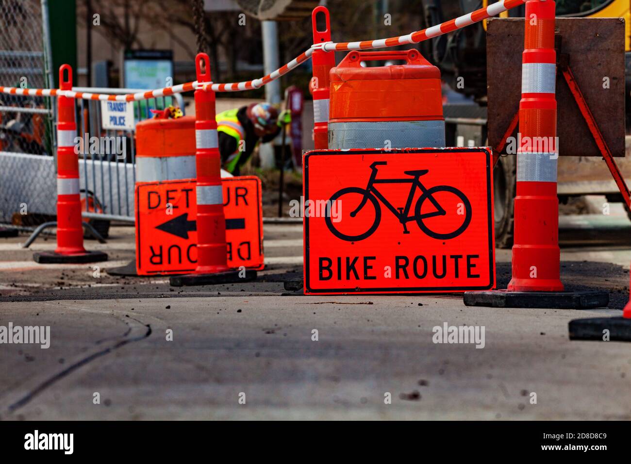 Orange street sign showing bike route detour during outdoor road ...