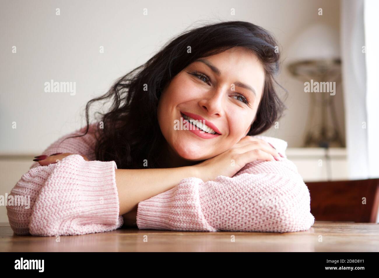 Woman leaning on table hi-res stock photography and images - Alamy