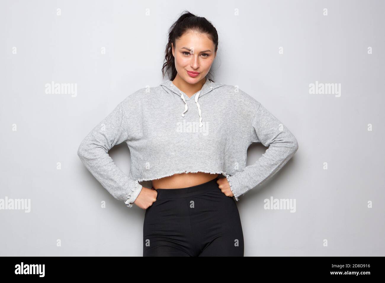 Portrait of athletic woman standing with determined expression Stock ...