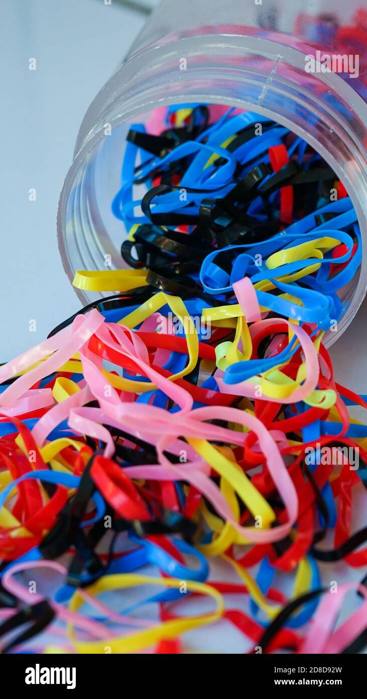 Close up of rubber band on white background Stock Photo - Alamy
