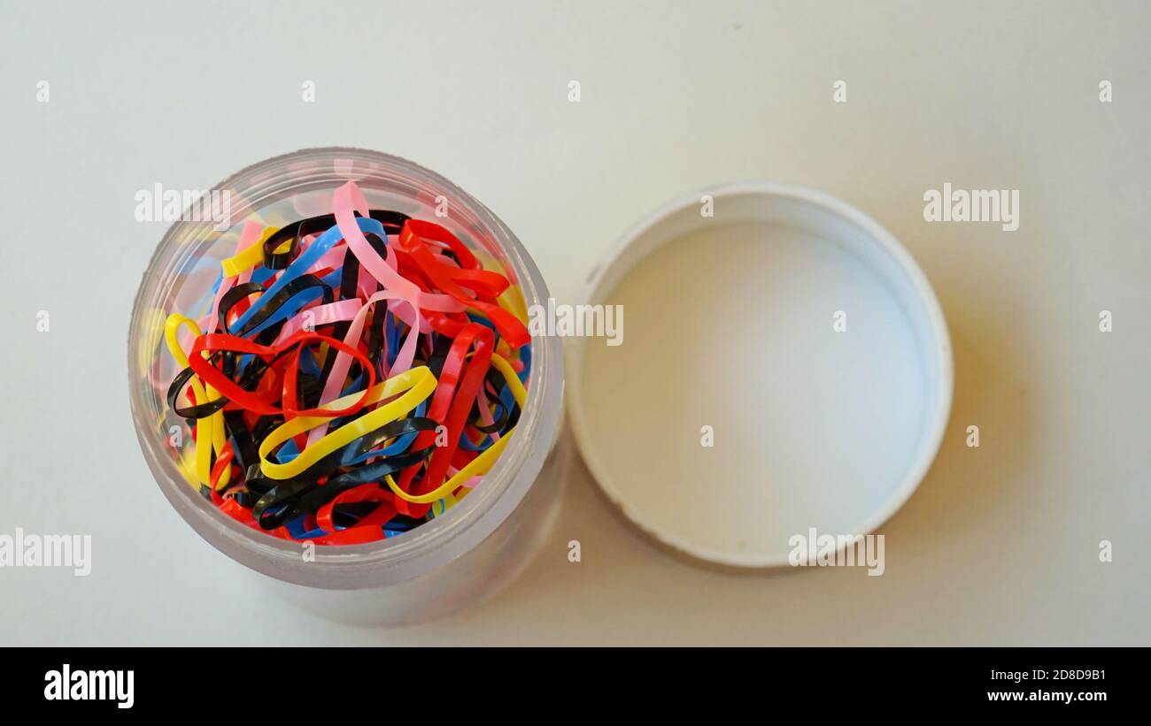 Close up of rubber band on white background Stock Photo - Alamy