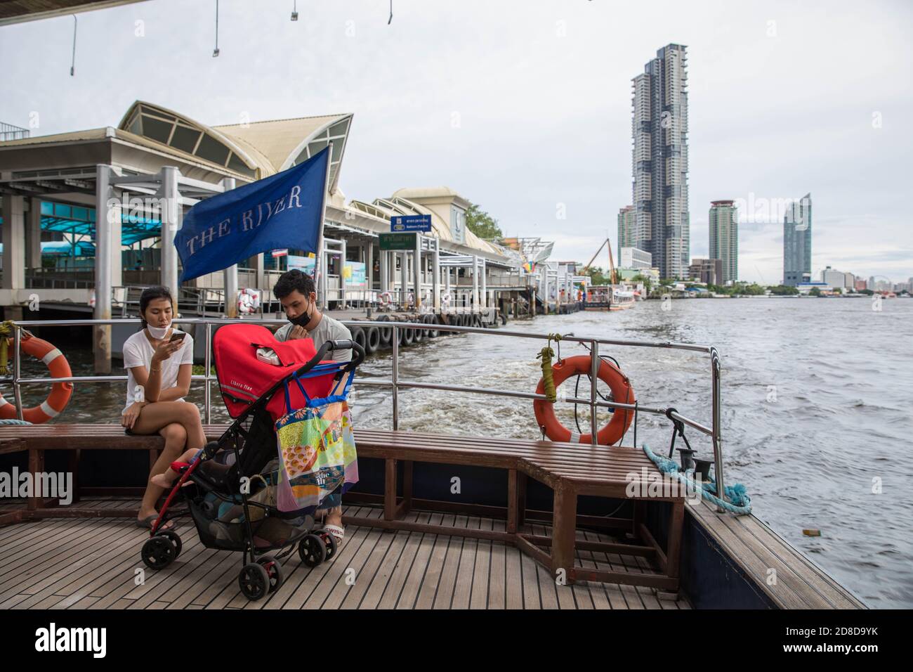 Bangkok, Thailand. 7th Sep, 2020. A couple and their child take a boat ...