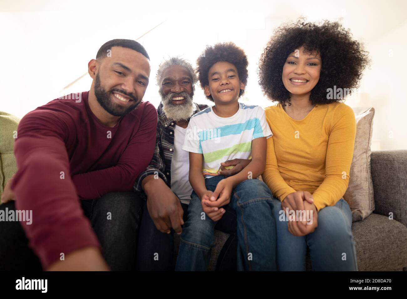 Portrait of Multi generation family smiling at home Stock Photo - Alamy