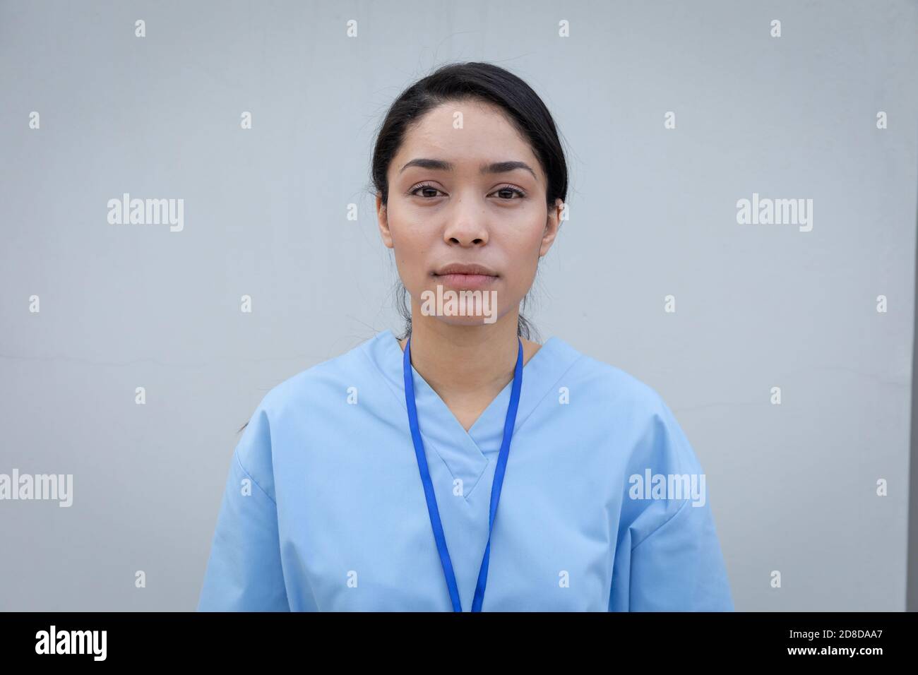 Portrait of female health professional against grey background Stock ...