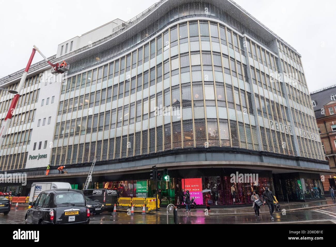 London, UK. 29 October 2020. Workmen install Christmas lights to the ...