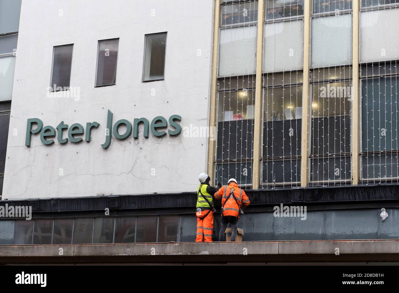 London, UK. 29 October 2020. Workmen install Christmas lights to the ...