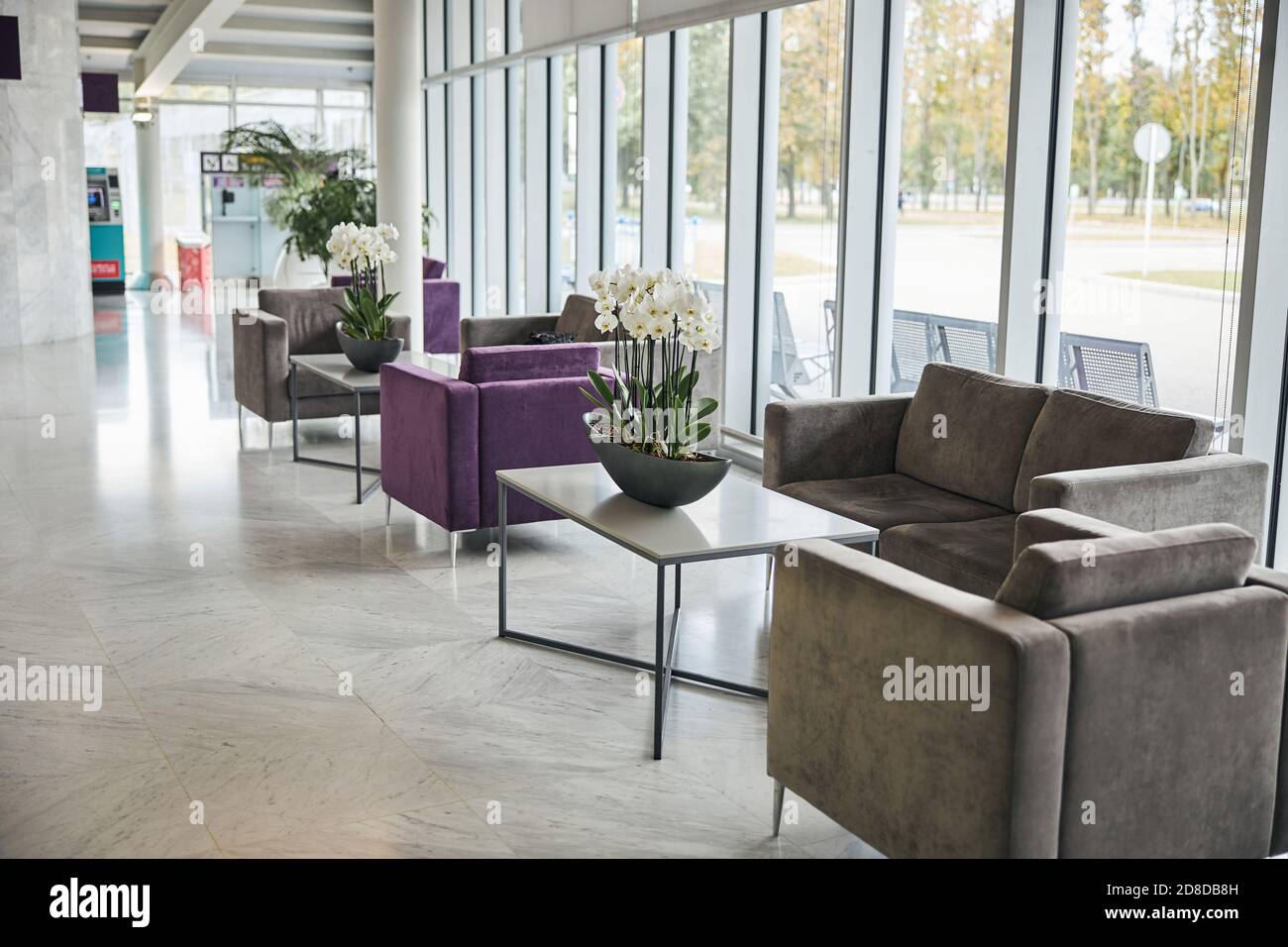 Empty airport terminal waiting area with comfortable furniture Stock ...