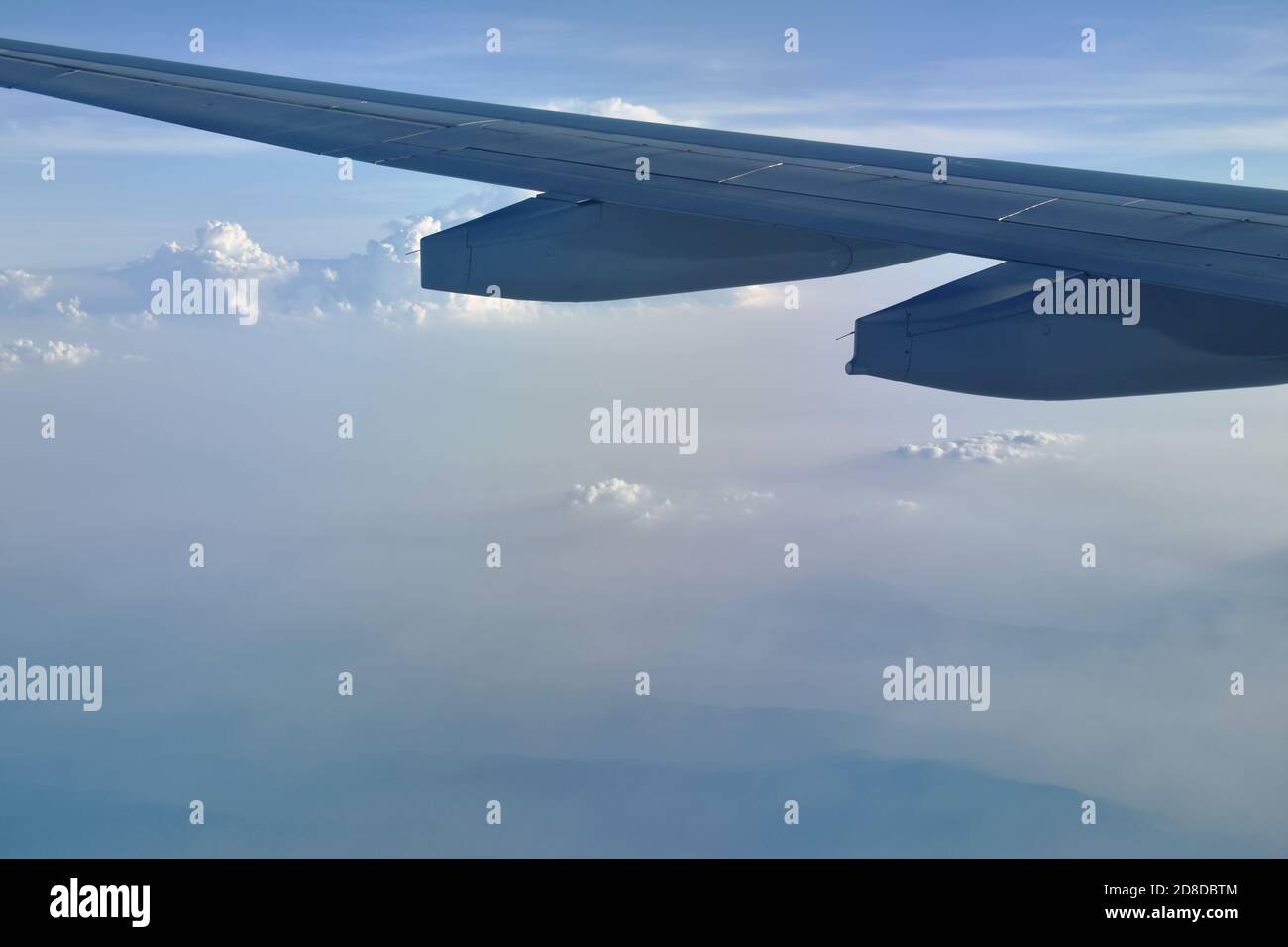 plane wing and cloud floating on sky through window frame Stock Photo ...