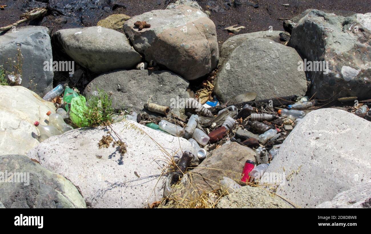 Plastic waste. Ecological dirt spilled garbage on the ground of the big ...